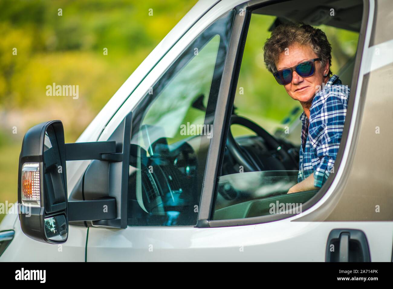 Caucasian Retired Woman Driving RV Camper Van. Motorhome Road Trip ...