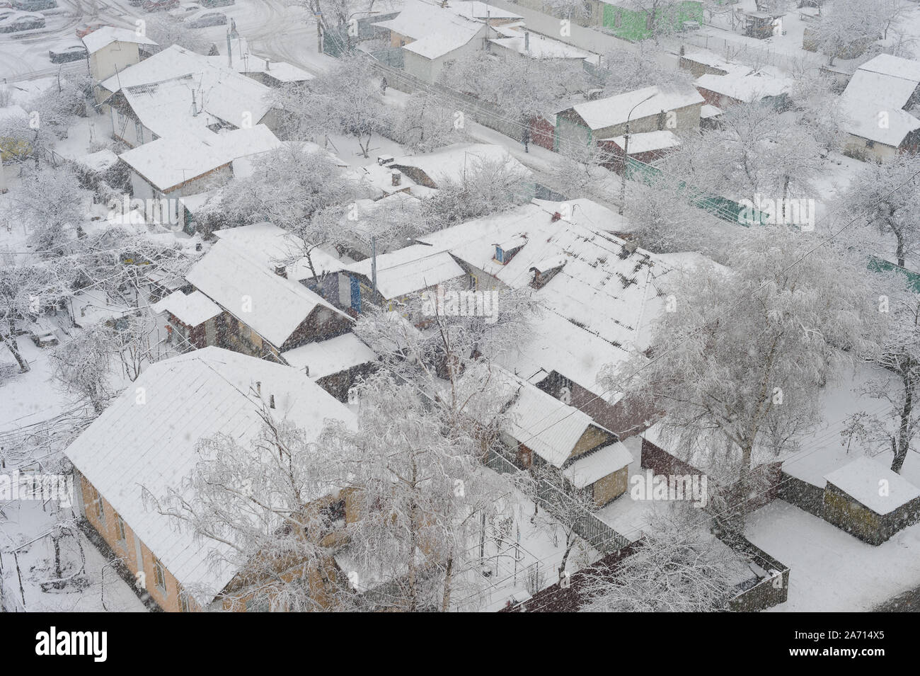 Aerail view of residential area and privat buildings in snowfall winter ...
