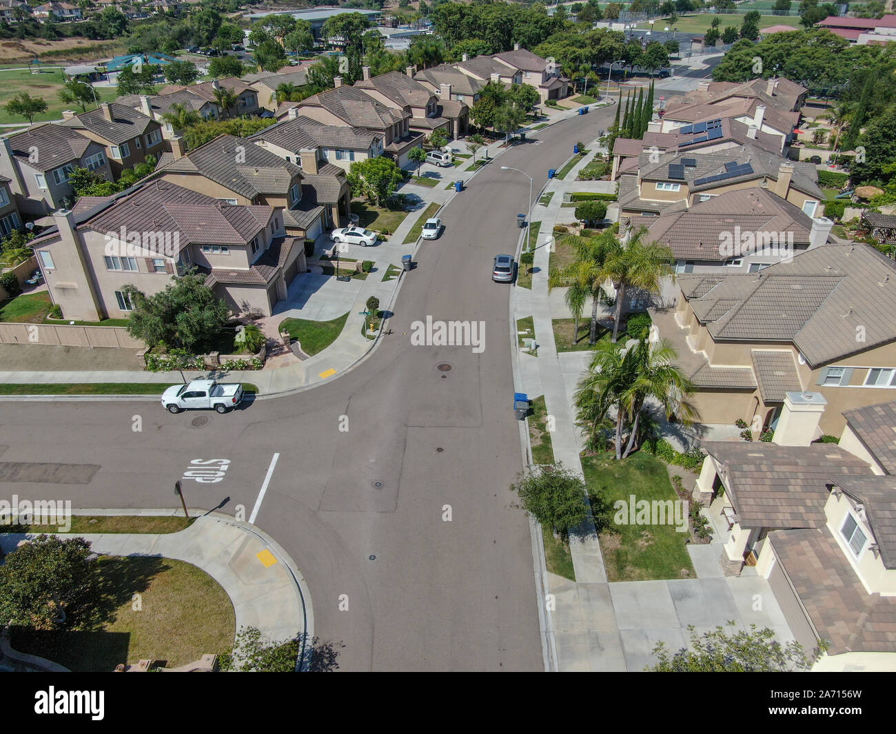 Suburban neighborhood street with big villas next to each other in ...