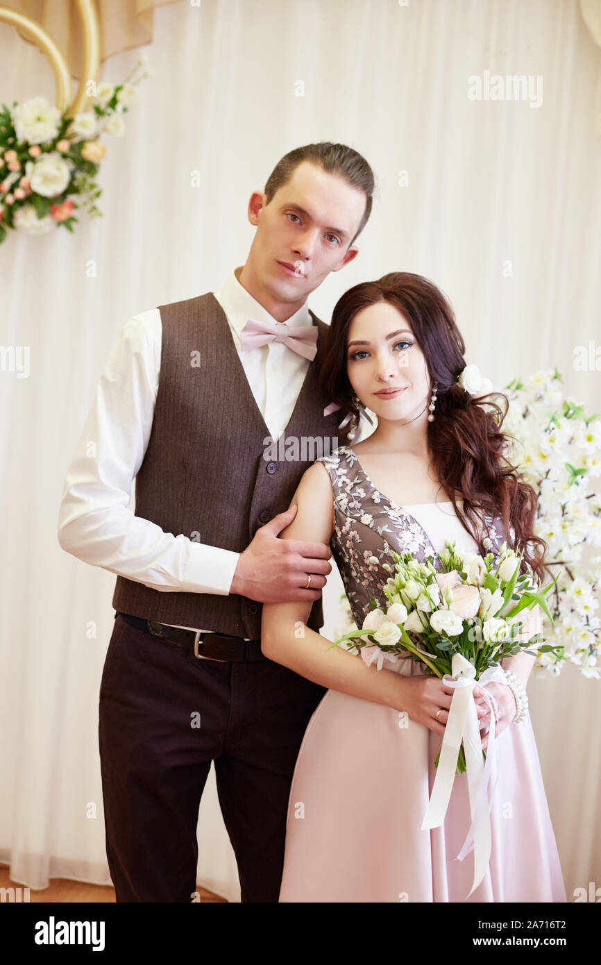 Bride and groom hug and pose for the wedding. Love and tenderness in ...