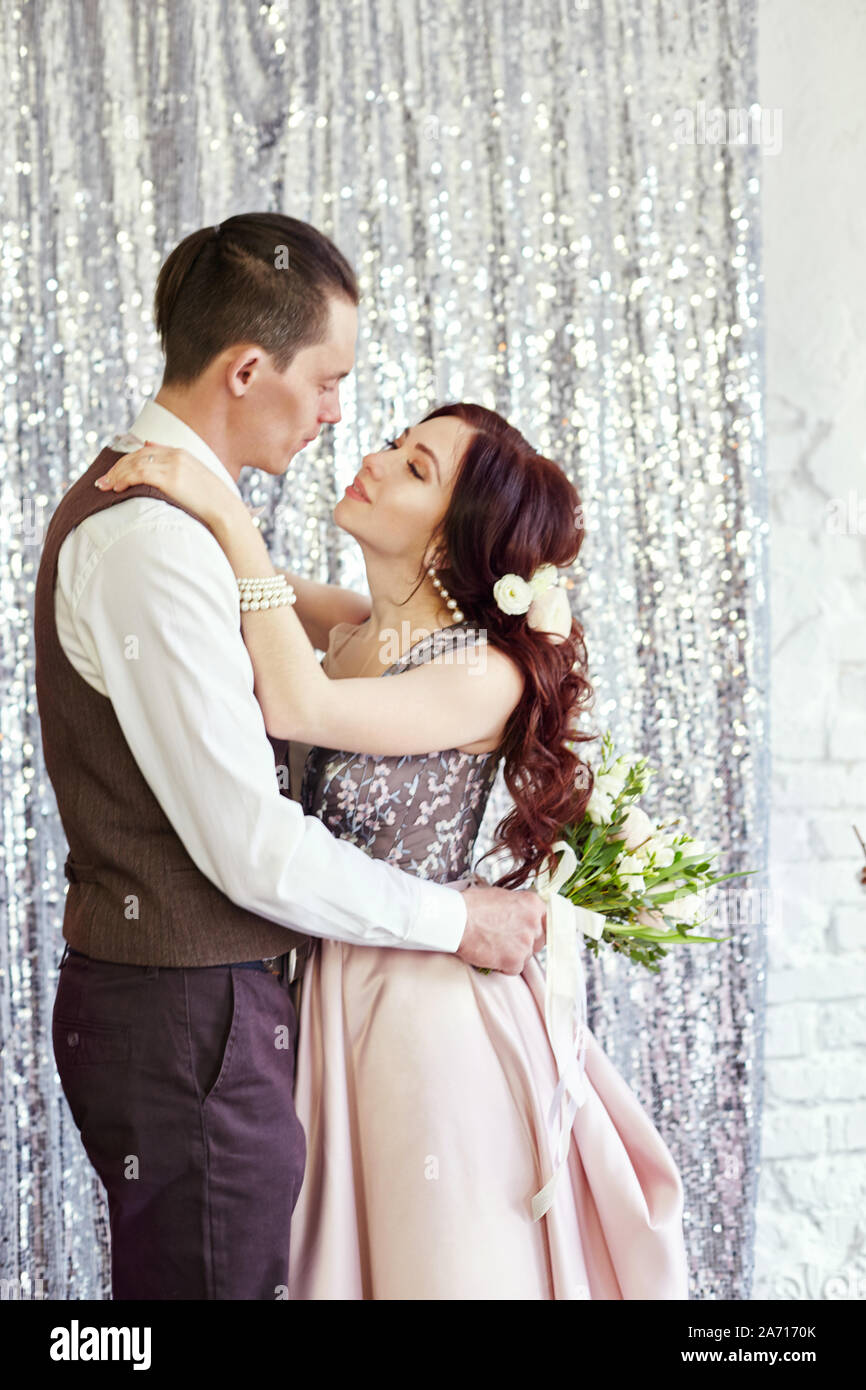 Bride and groom hug and pose for the wedding. Love and tenderness in ...