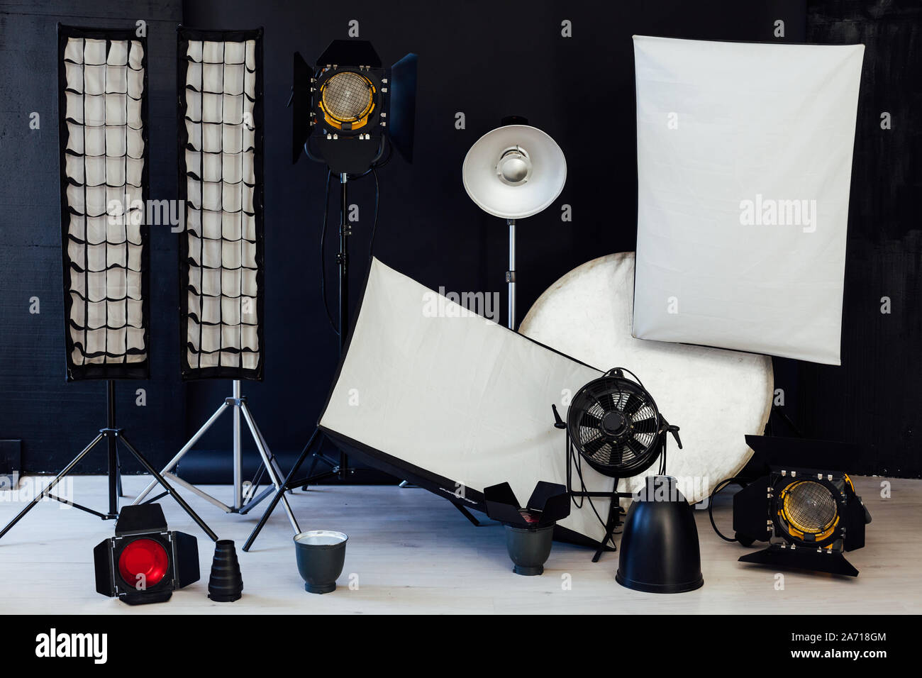 Photo studio equipment flash accessories photographer on black ...