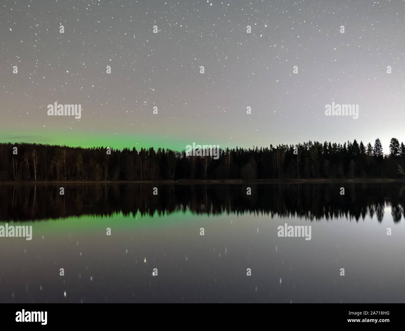 landscape with a beautiful colorful night sky and stars, reflection on ...