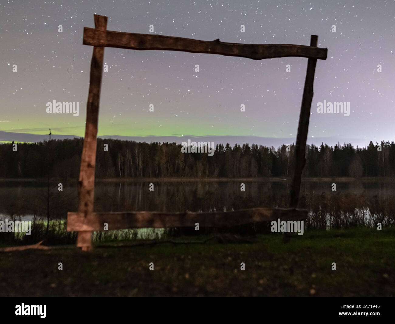 landscape with a beautiful colorful night sky and stars, reflection on ...