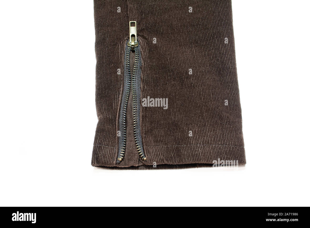 Open zipper on the sleeve of a corduroy jacket on a white background ...