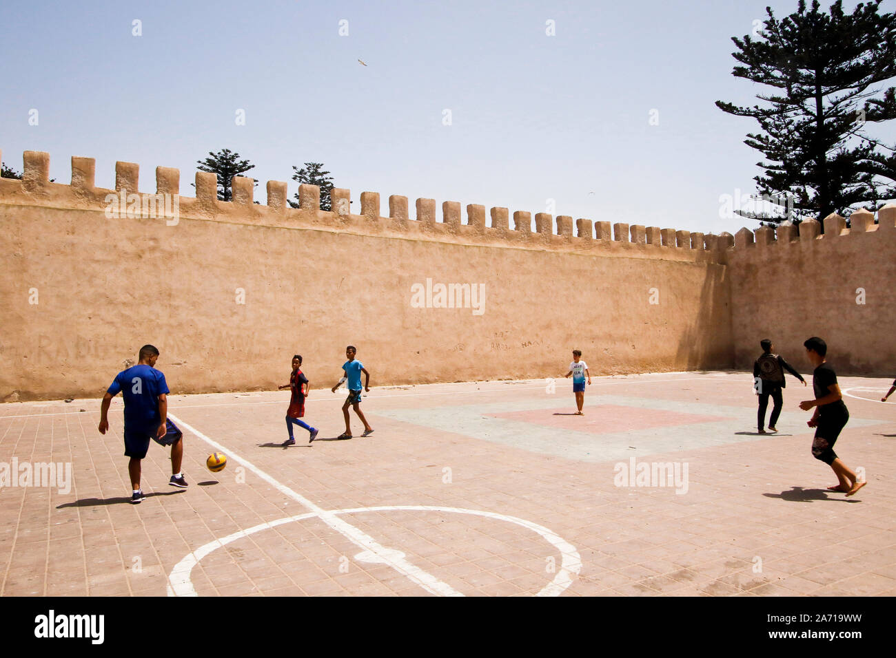 Boys playing football in the street hi-res stock photography and images ...