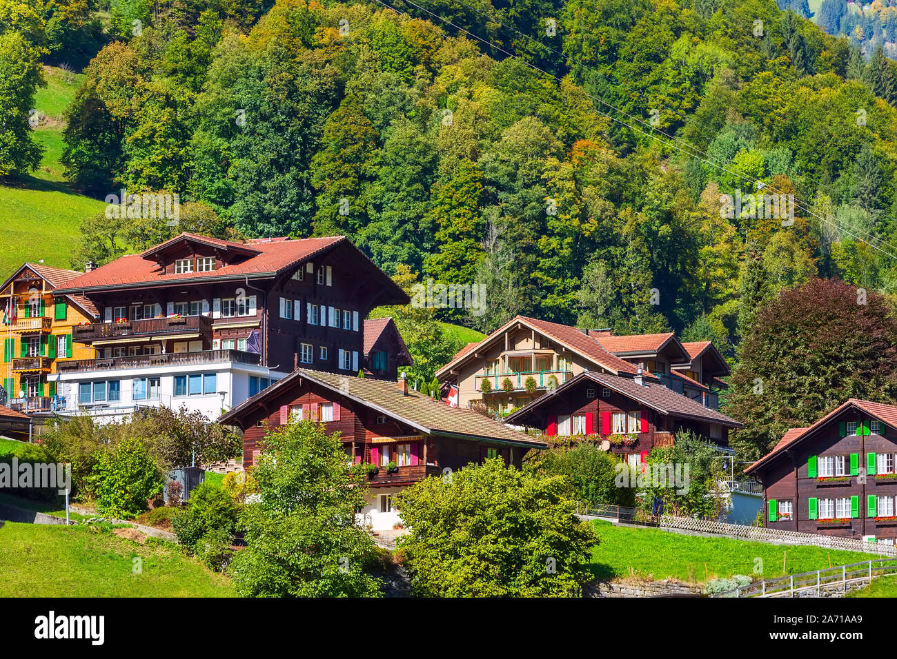 Lauterbrunnen, Switzerland alpine wooden houses in Swiss Alps village ...