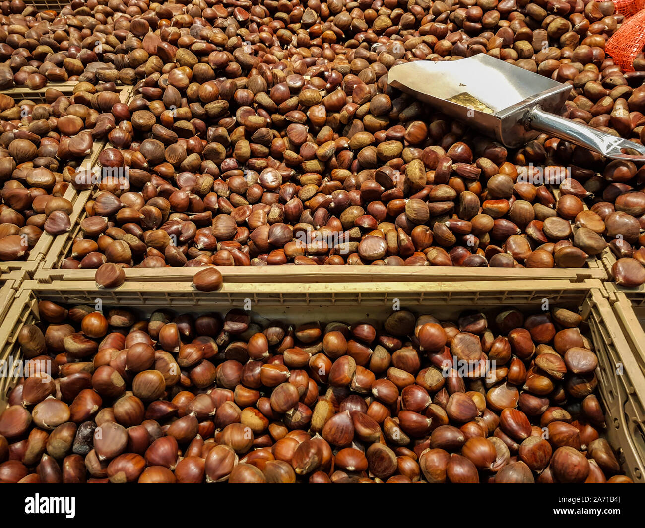 Boxes of chestnuts and shovel Stock Photo - Alamy