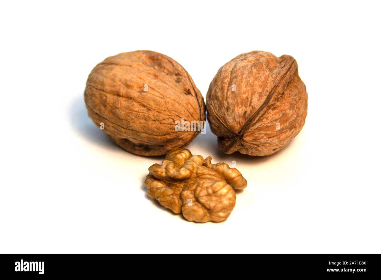 Walnuts in a shell and without it on a white background Stock Photo - Alamy
