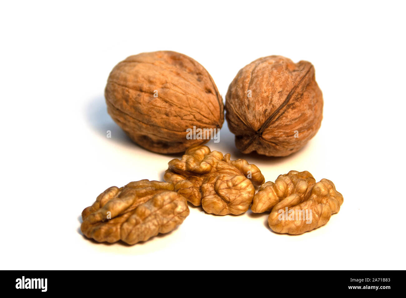 Walnuts in a shell and without it on a white background Stock Photo - Alamy