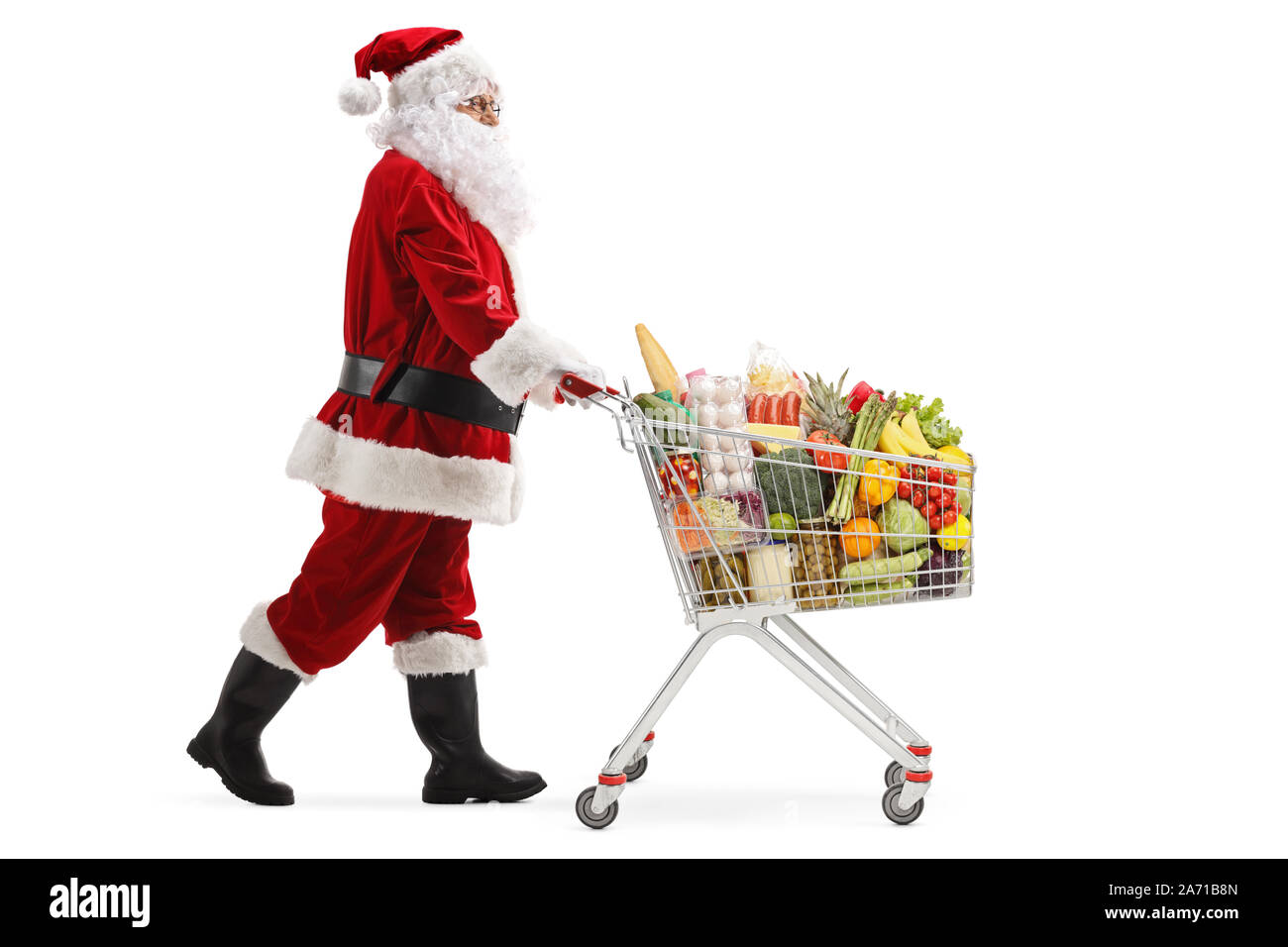Full length profile shot of Santa Claus walking and pushing a shopping ...