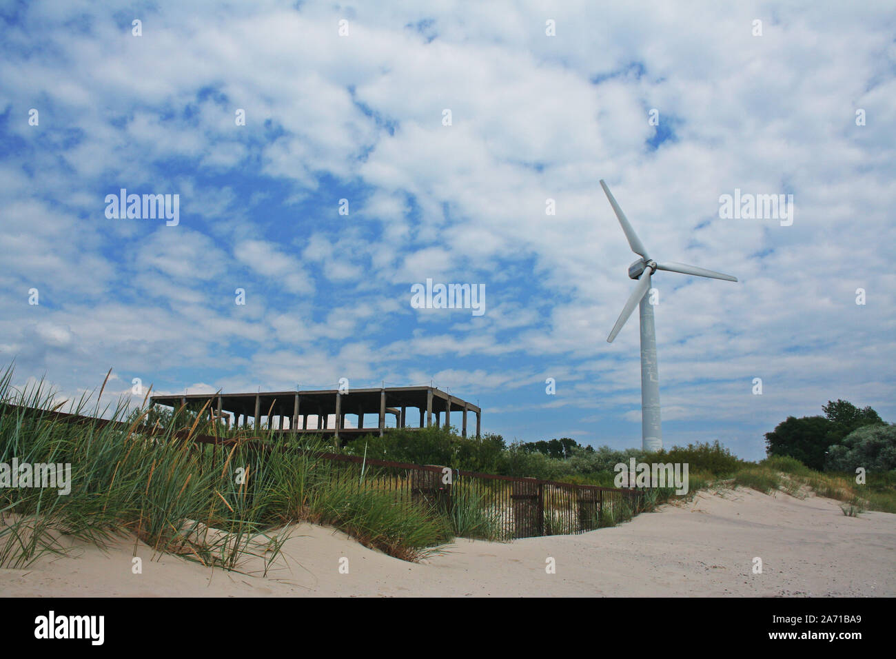 Bright picture of wind turbine standing near unfinished building Stock ...