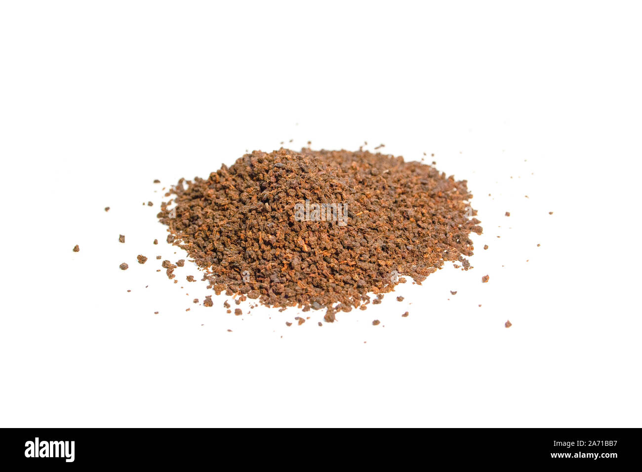 Black granular tea on a white background Stock Photo - Alamy