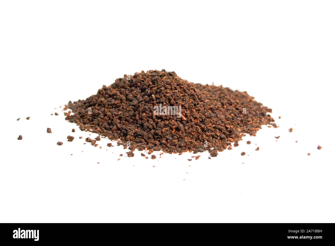 Black granular tea on a white background Stock Photo - Alamy