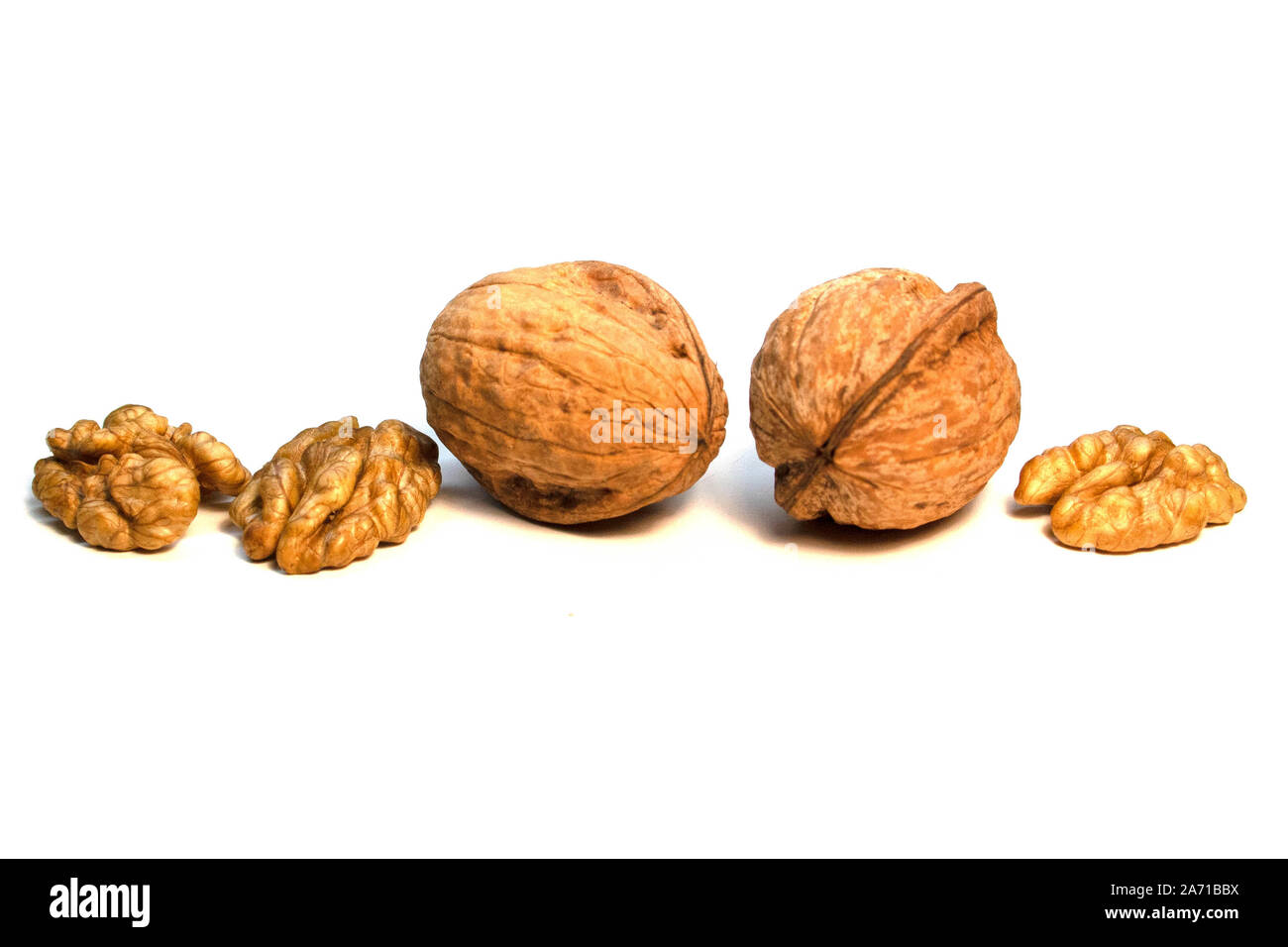 Walnuts in a shell and without it on a white background Stock Photo - Alamy