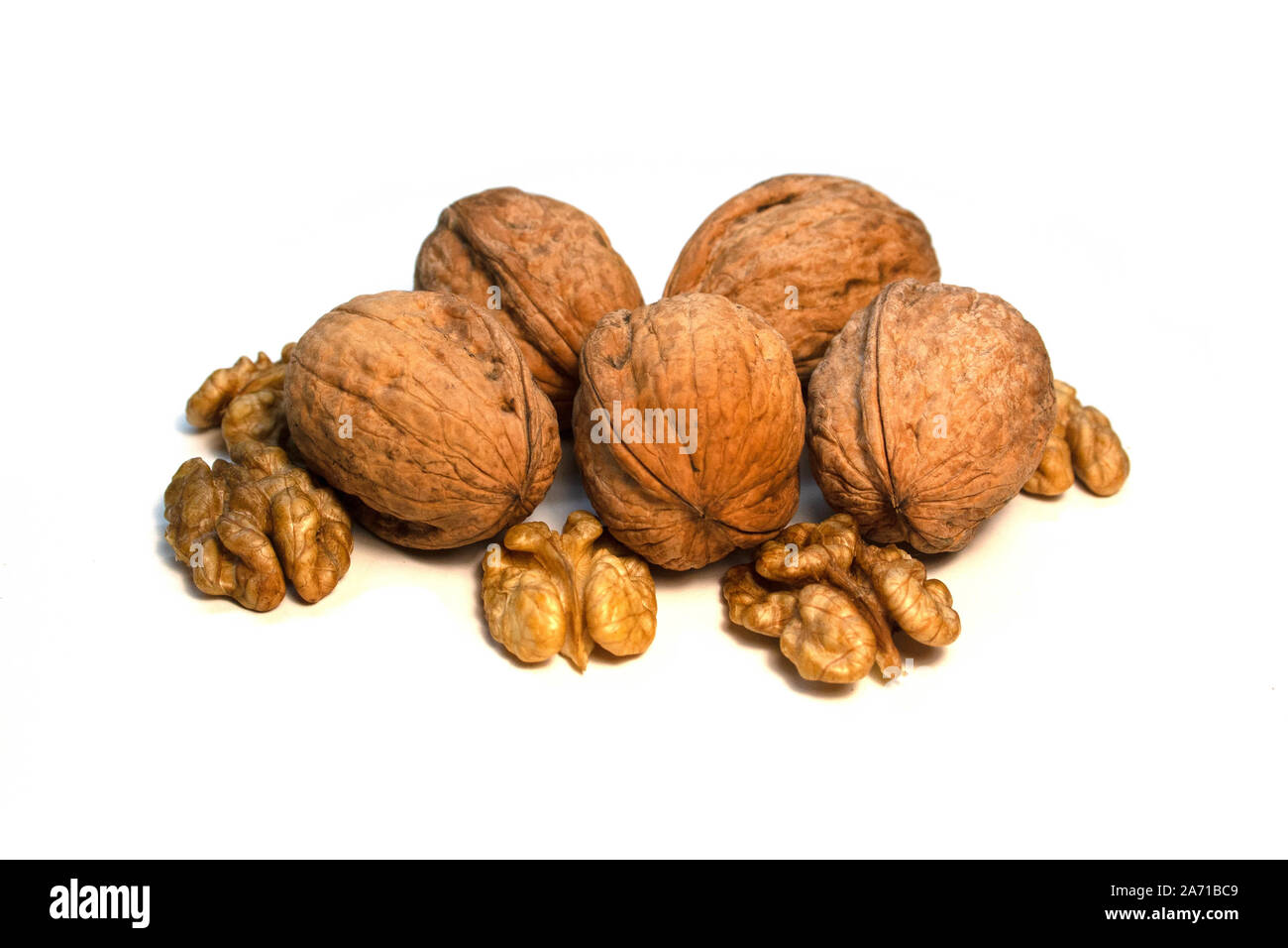 Walnuts in a shell and without it on a white background Stock Photo - Alamy