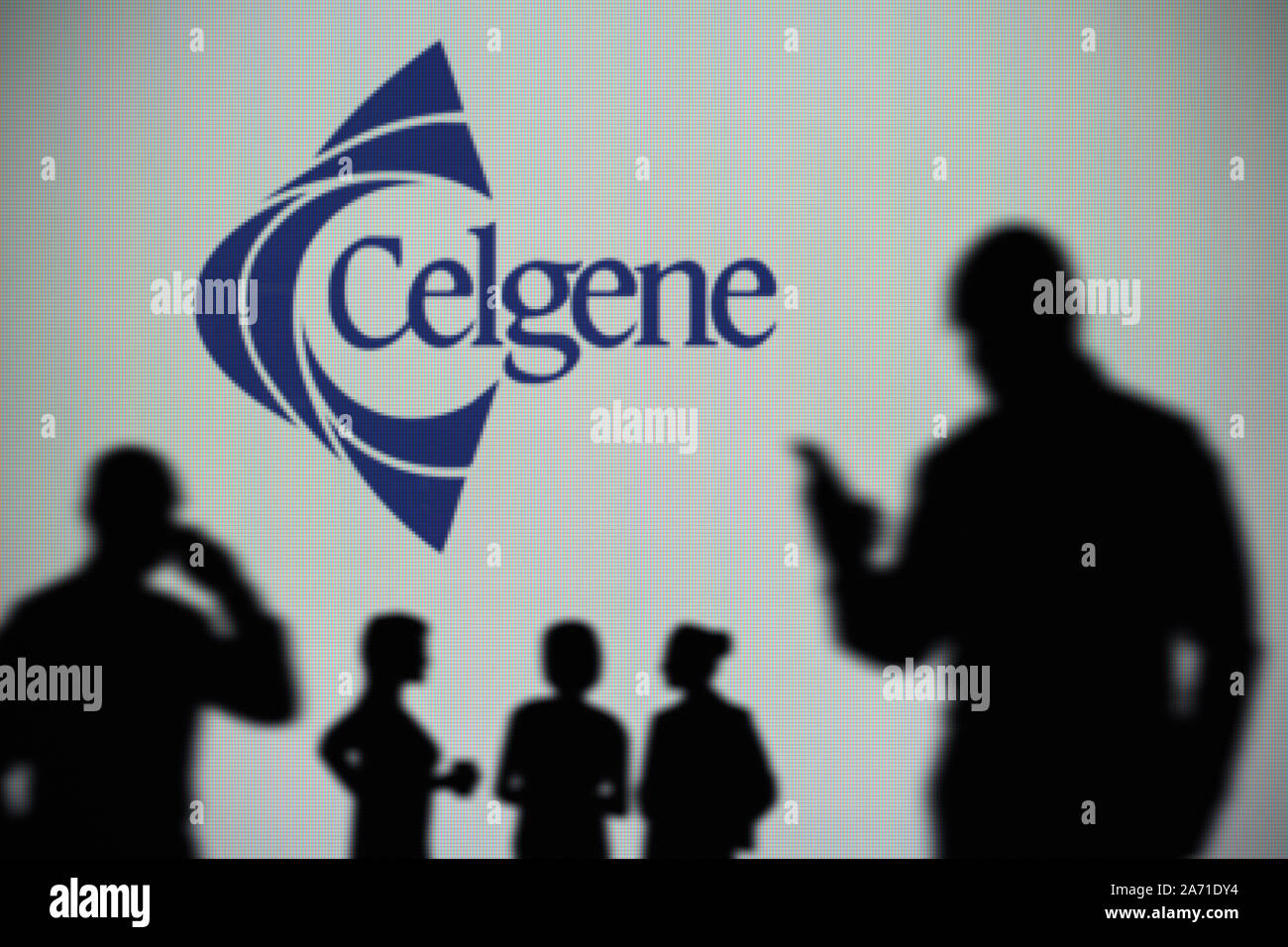 The Celgene logo is seen on an LED screen in the background while a ...