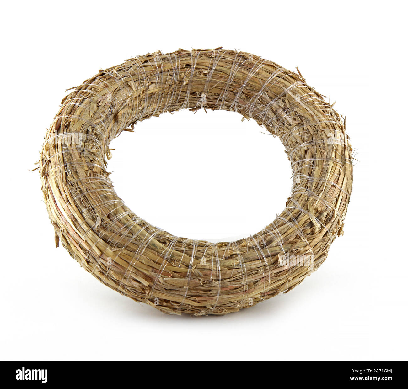 Christmas wreath made of straw on white background. It is the basis for ...