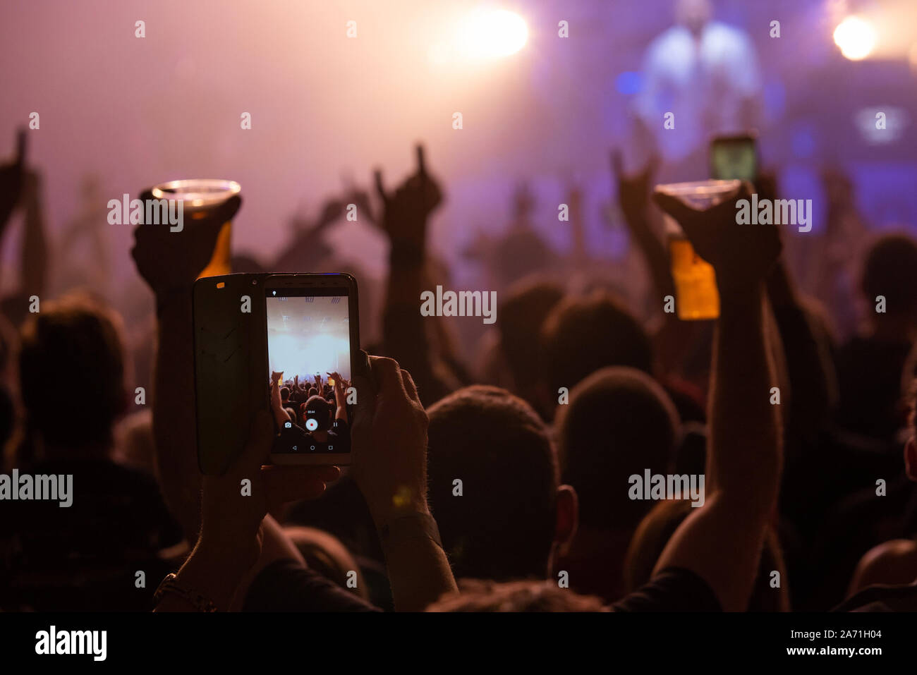 Audience at a concert and recording on the phone Stock Photo - Alamy
