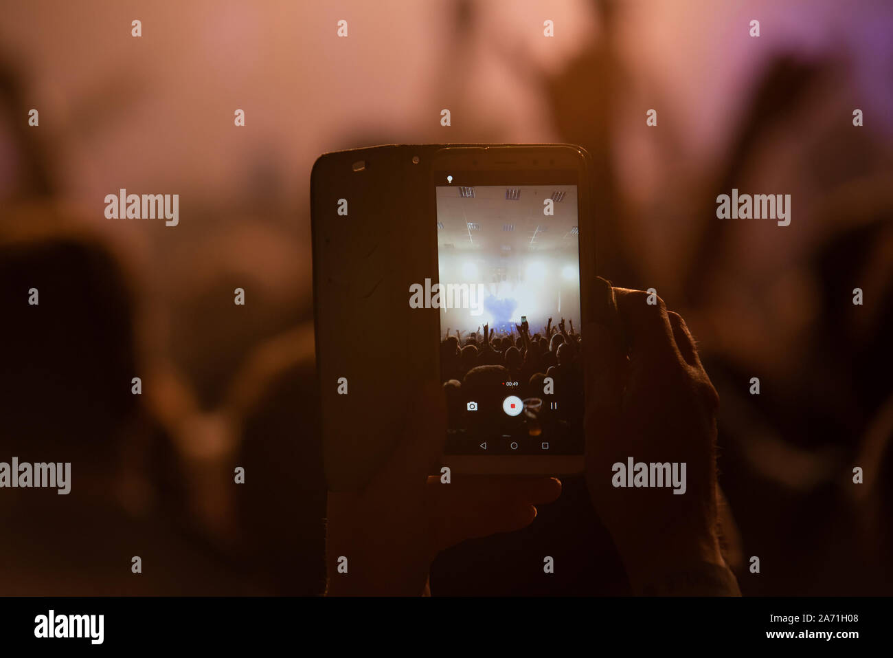 Audience at a concert and recording on the phone Stock Photo - Alamy