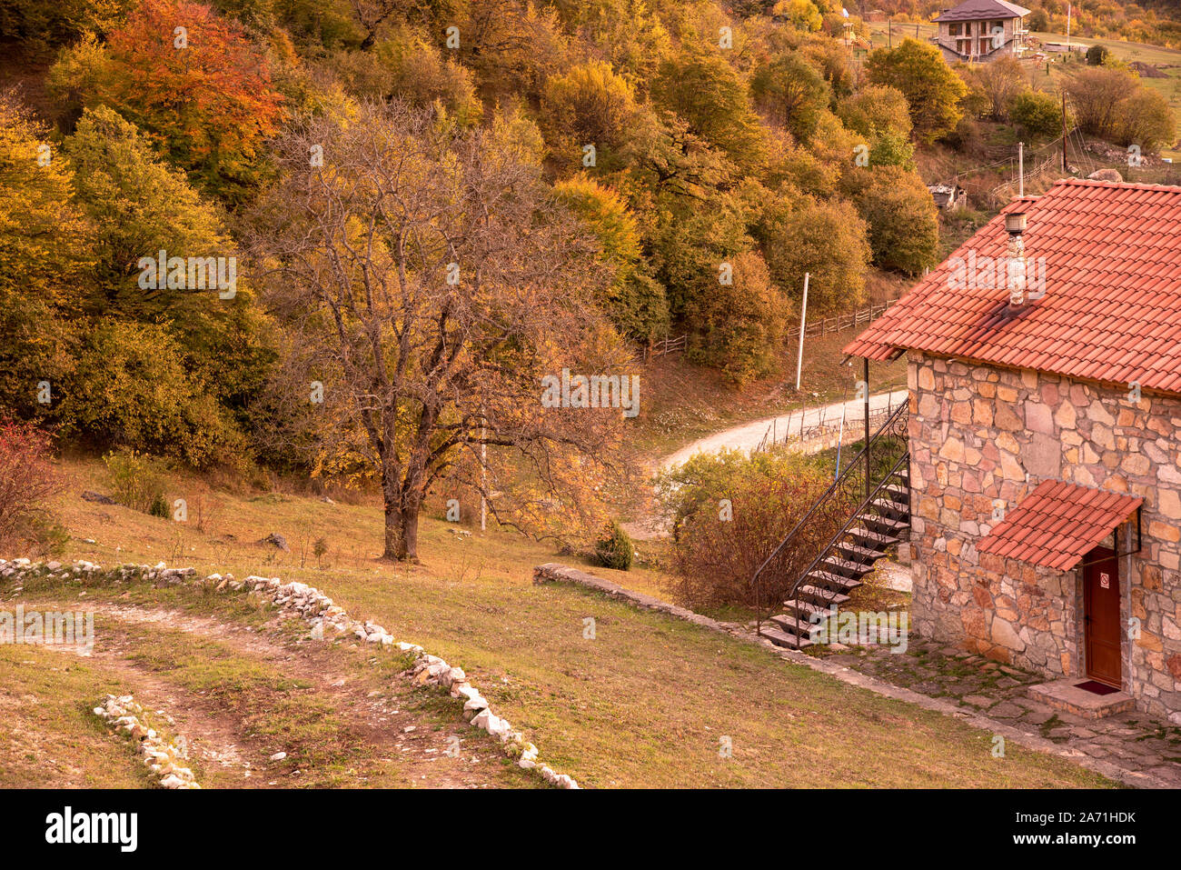 Autumn landscape. Hills, forest and a fragment of a stone house Stock ...