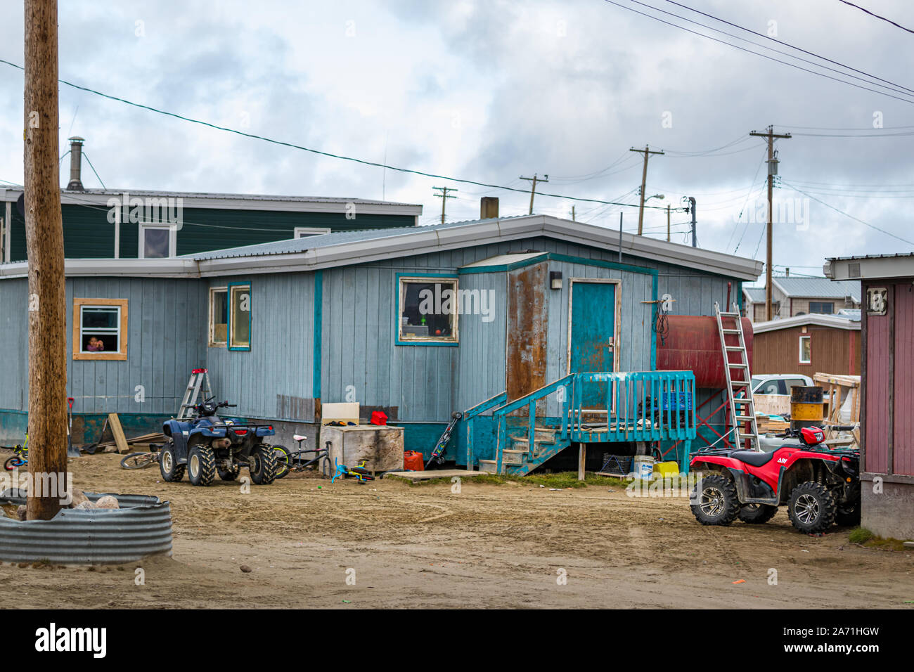 Residential houses and quadricycles in Clyde River, Nunavut, Canada ...