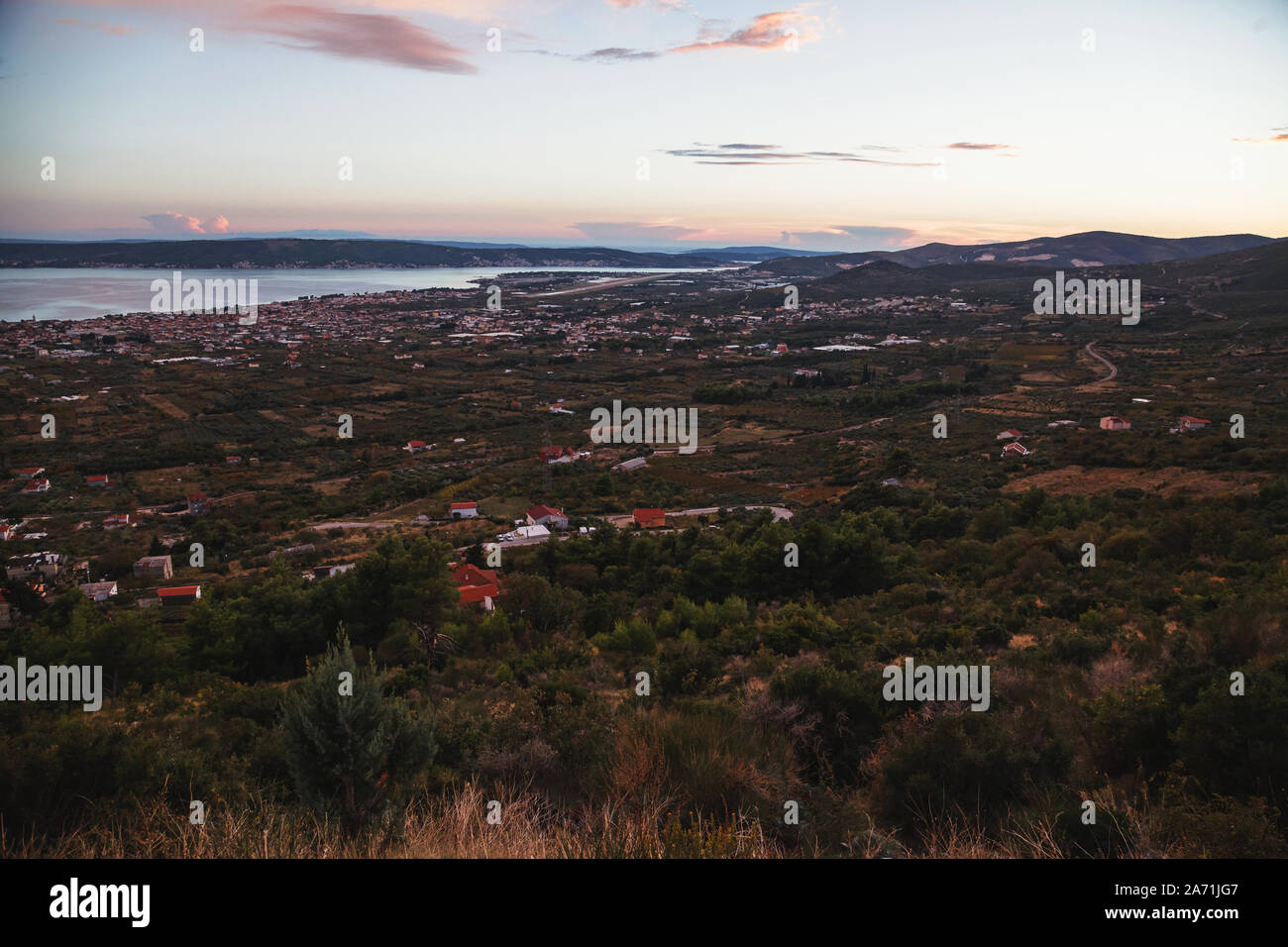 Simple top view late summer landscape on sunset small town by the sea ...