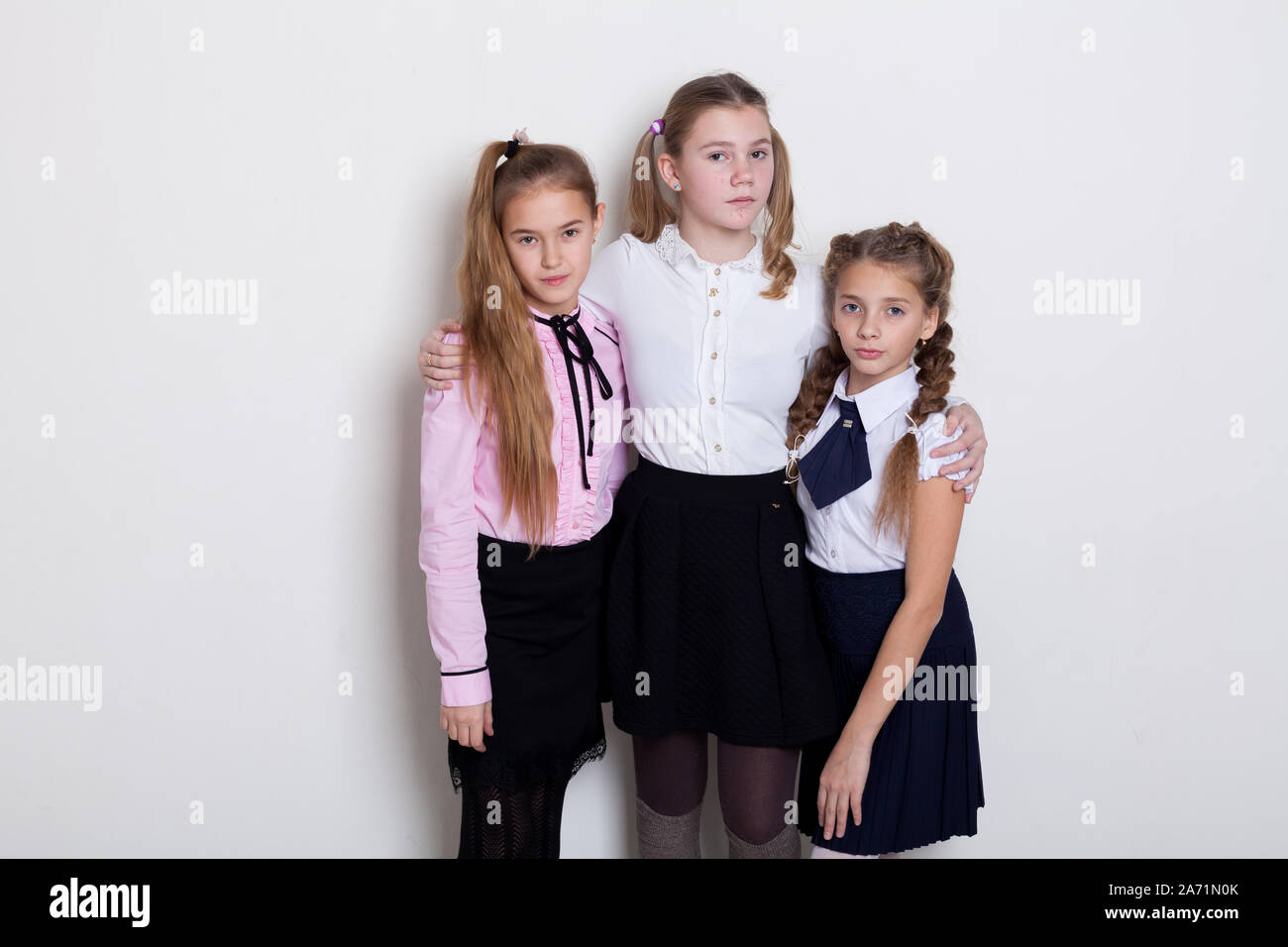 three schoolgirls in class at the school board Stock Photo - Alamy