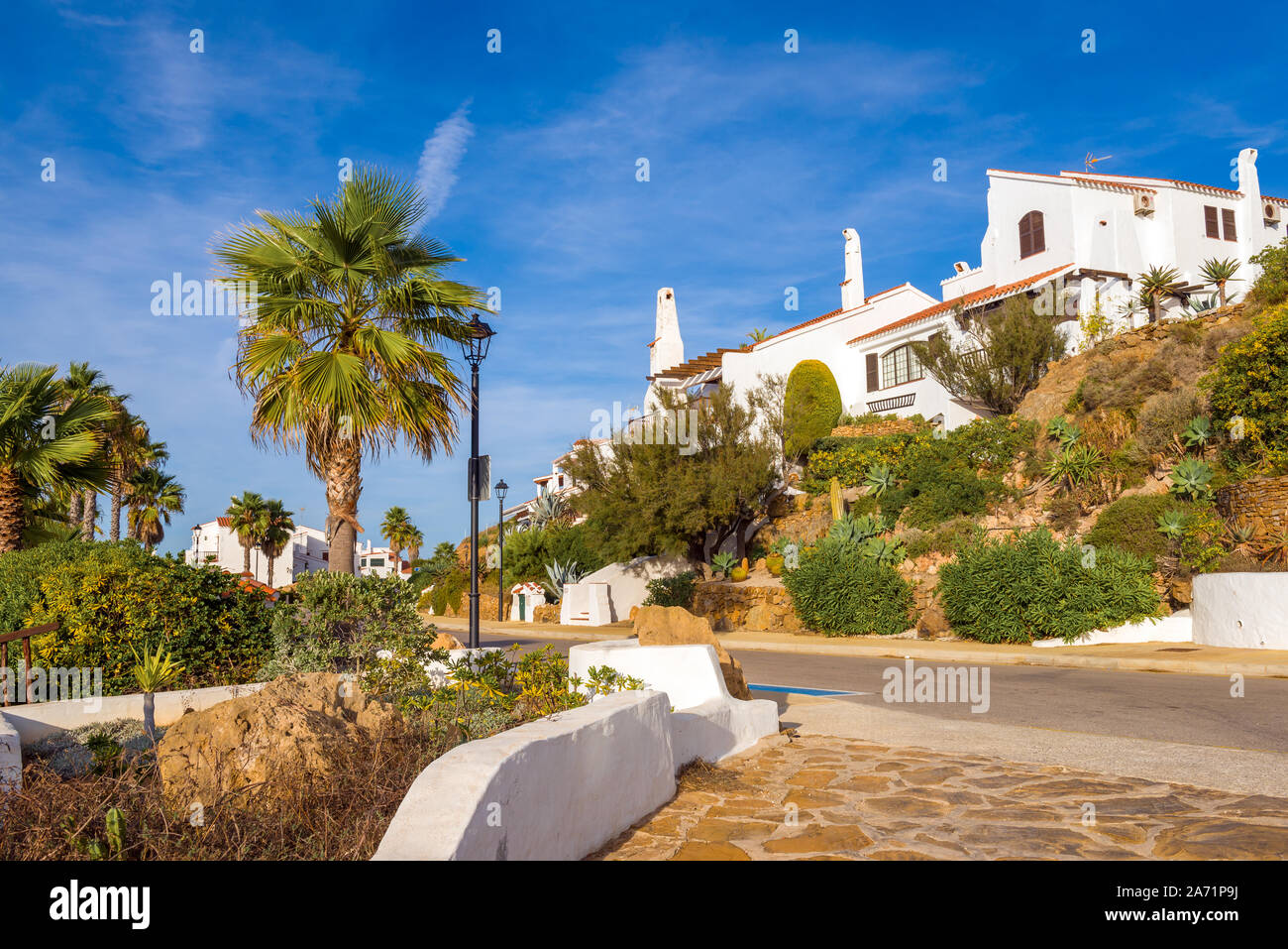 Traditional Spanish architecture with summer villas on hills. Island of ...