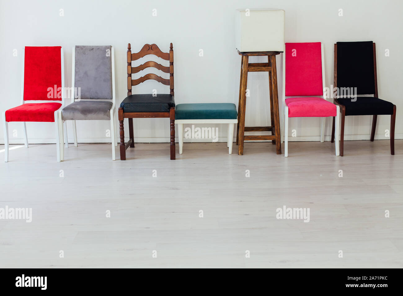 different multicolored chairs in the interior of the white room Stock ...