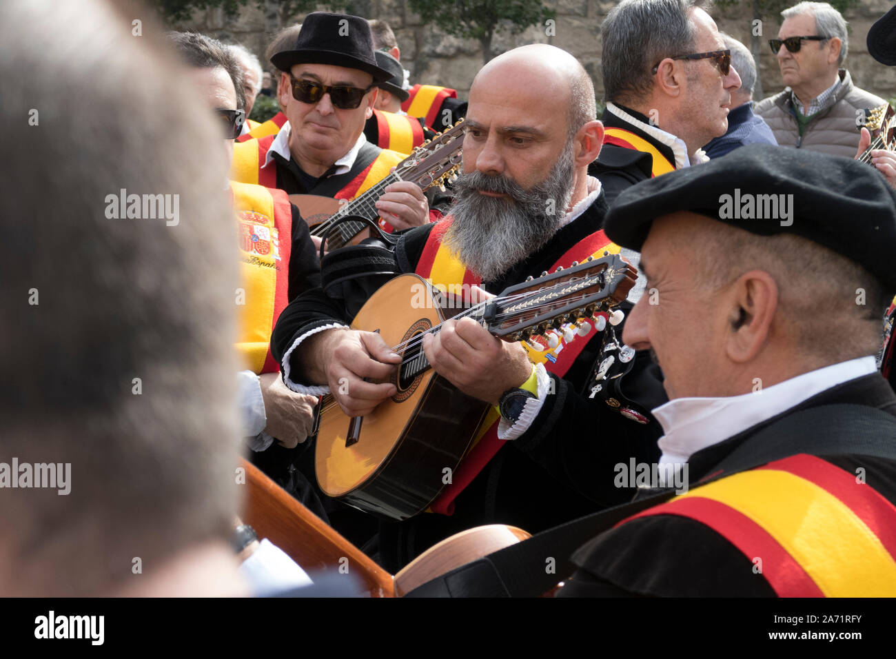 Musicians in traditional costumes playing in Spanish town of Seville ...