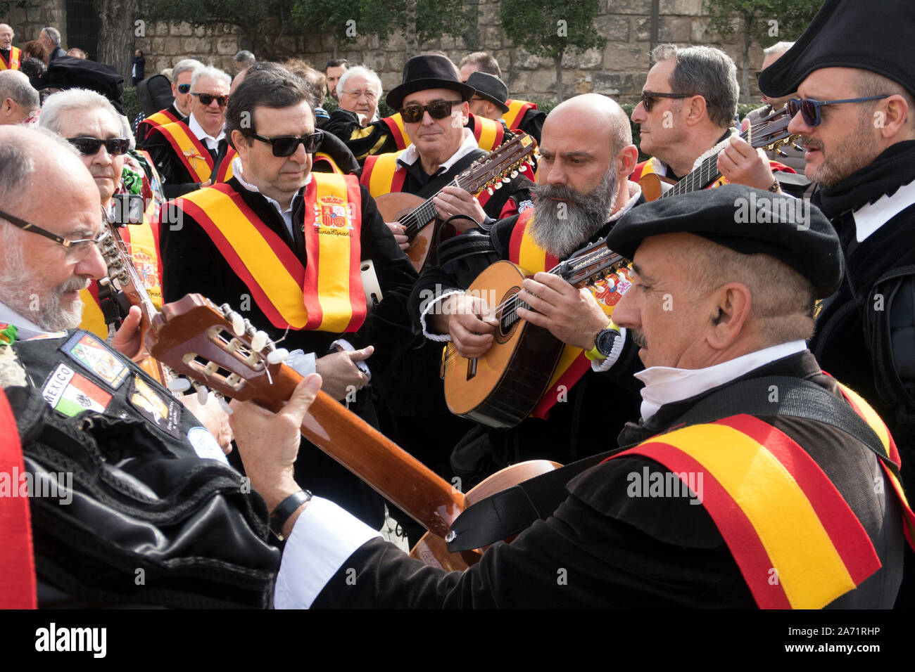 Musicians in traditional costumes playing in Spanish town of Seville ...
