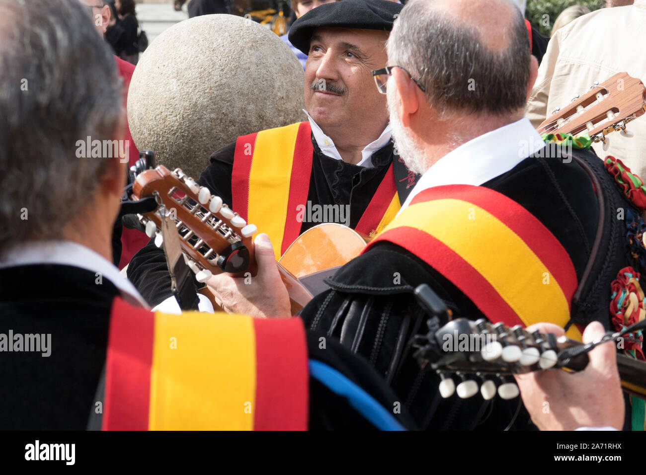 Musicians in traditional costumes playing in Spanish town of Seville ...