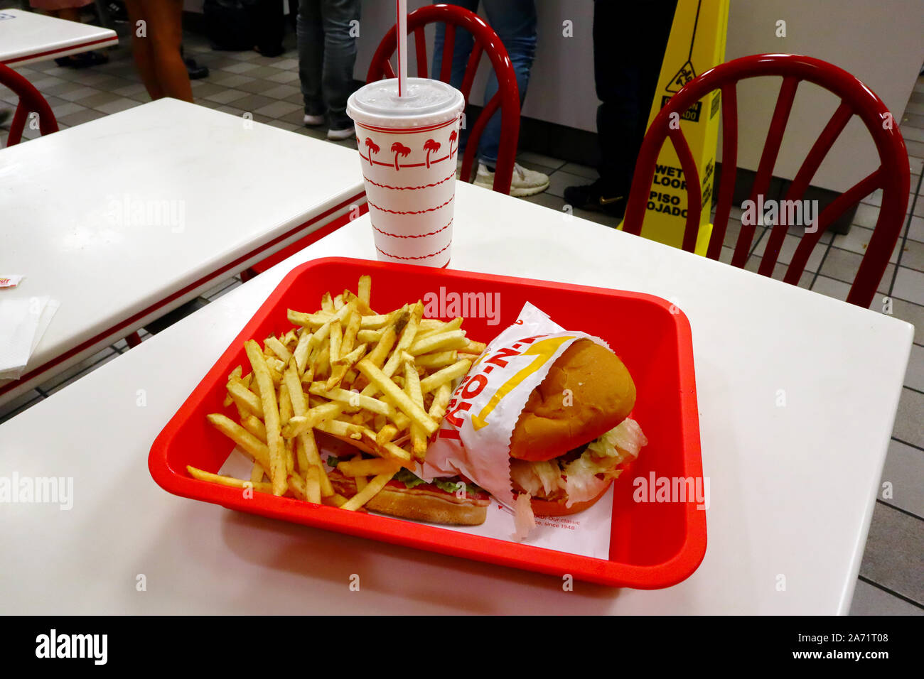 IN-N-OUT Burger - Hamburger and french fries in a tray on the table ...
