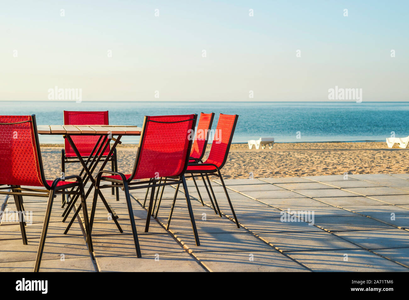 Outdoor beach restaurant at tropical resort.Tables and chairs in a cafe ...