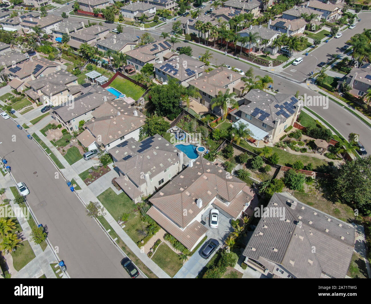 Suburban neighborhood street with big villas next to each other in ...