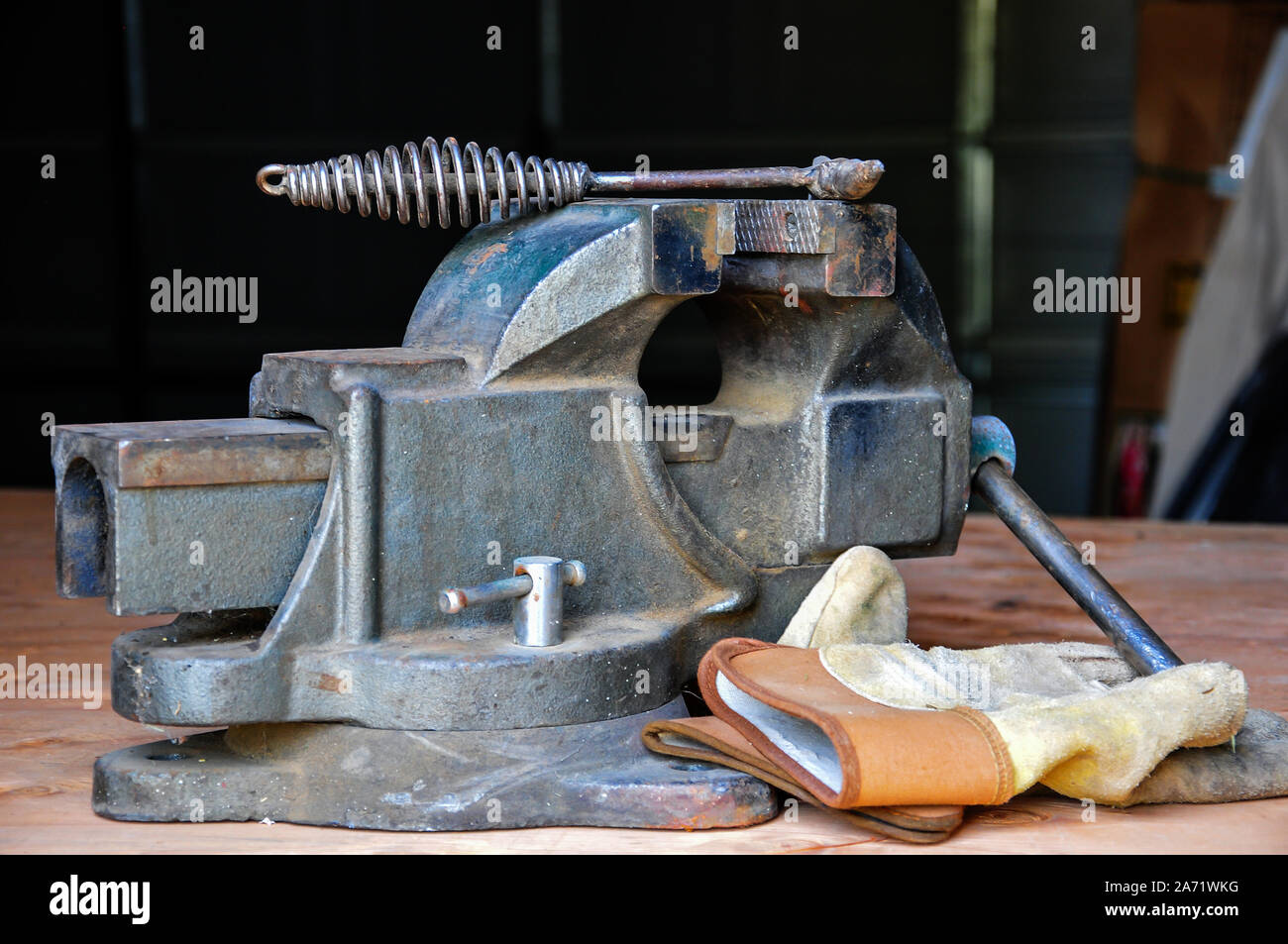 An iron vise and chipping hammer sitting on the bench where they were ...