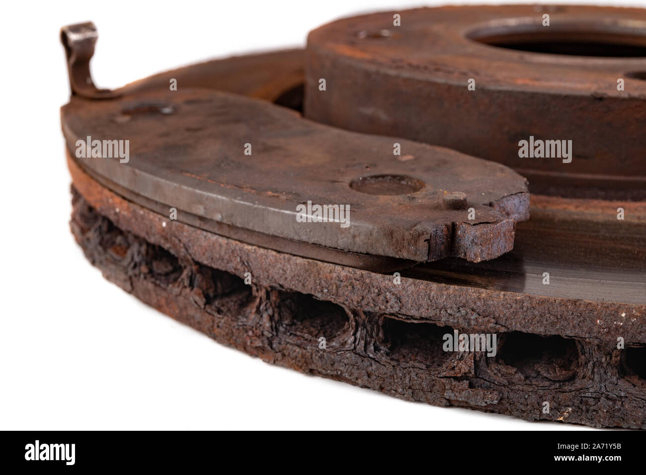 Old rusty brake disc and worn block. Used spare parts for passenger ...