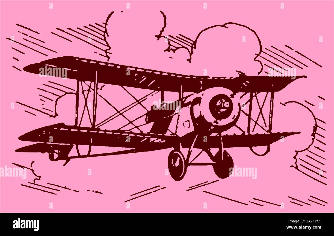Historical biplane aircraft flying under a cloudy pink sky at sundown ...