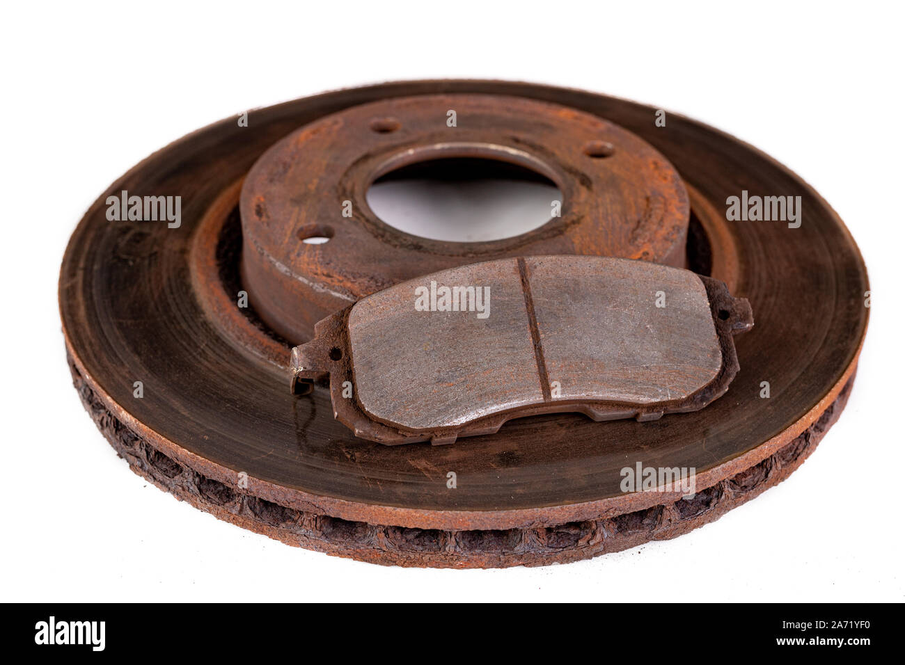 Old rusty brake disc and worn block. Used spare parts for passenger ...