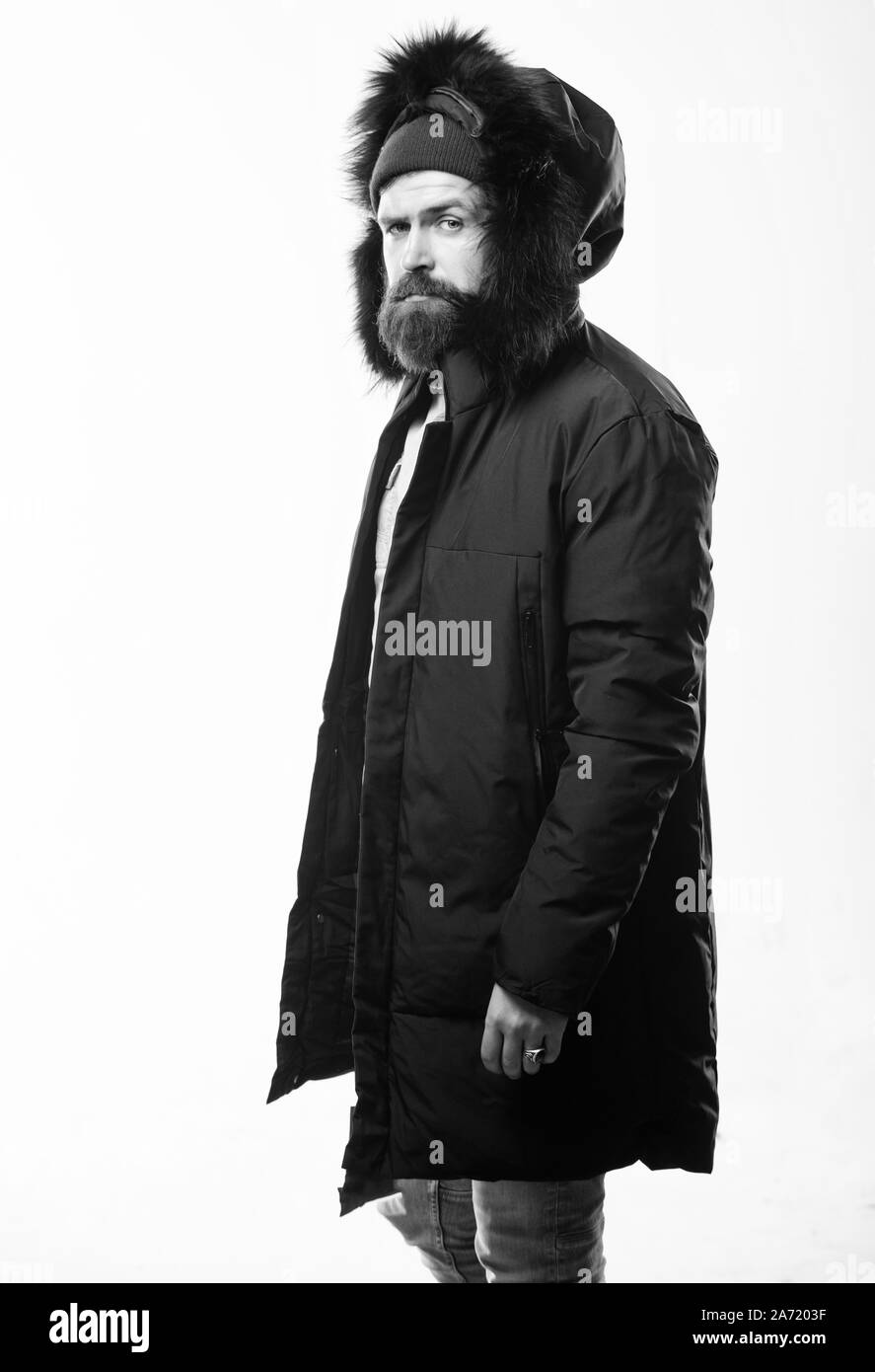 Hipster winter fashion. Guy wear black winter jacket with hood ...