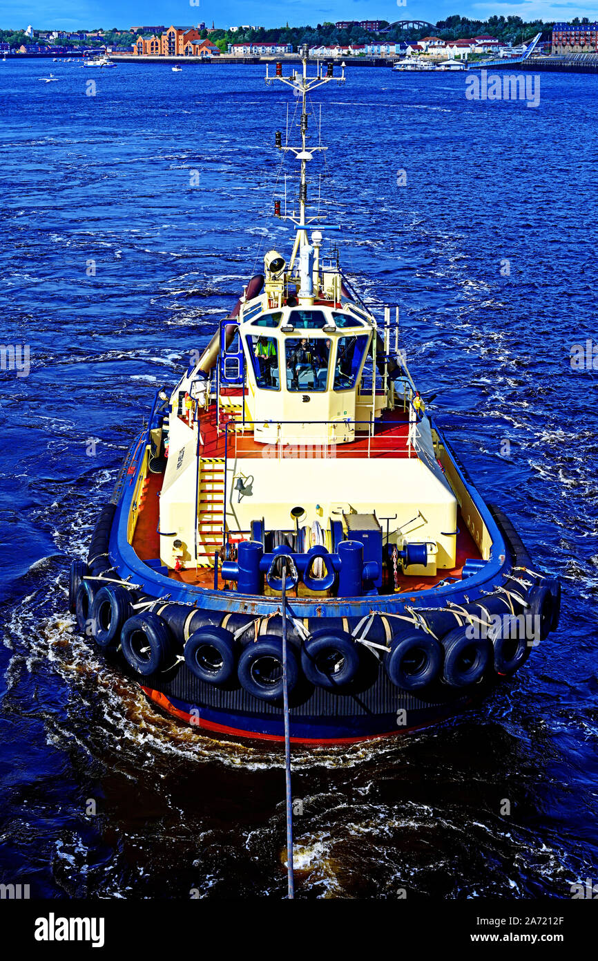 Front view of the Tyne tug Svitzer Sun as she tugs a cruise ship out of ...