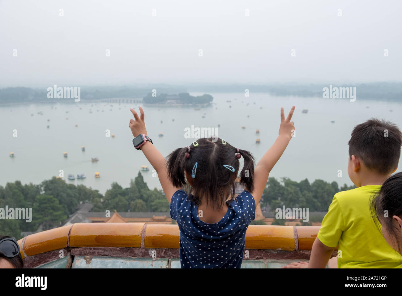Girl looking over the lake Stock Photo - Alamy