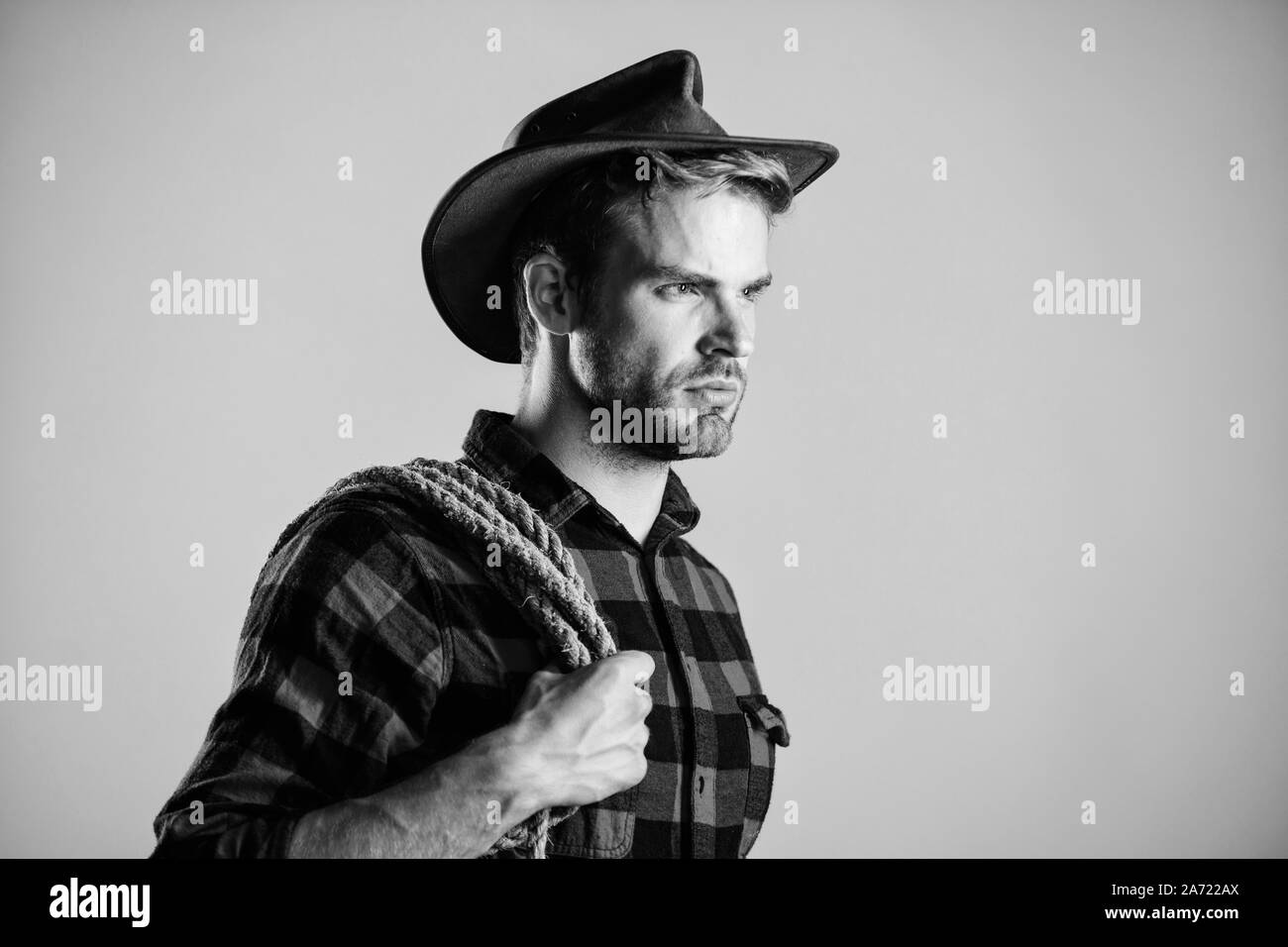 ready to ride. man checkered shirt on ranch. wild west rodeo. man in ...