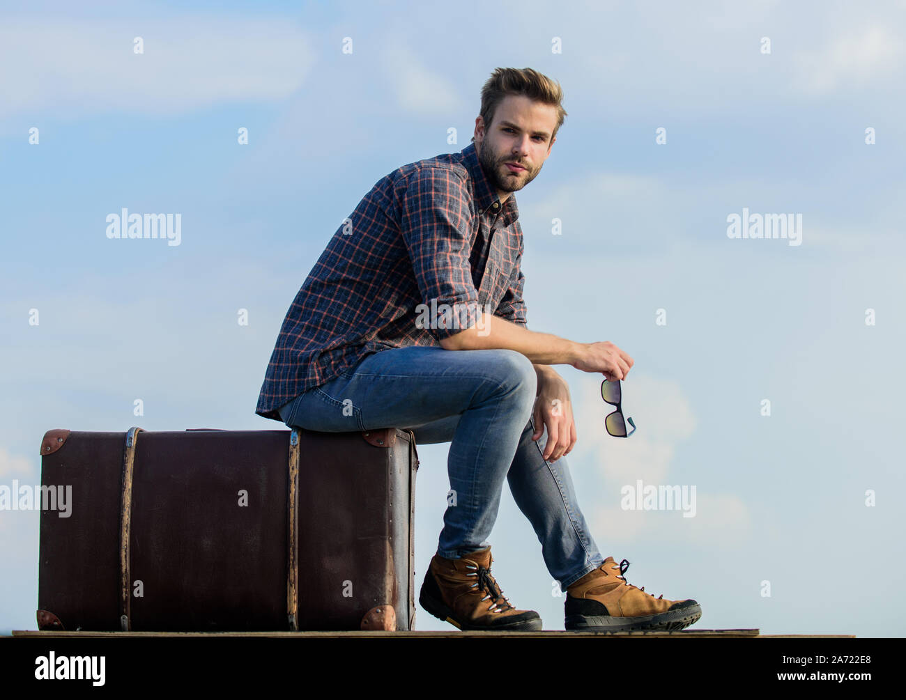 Business trip. Handsome guy traveler. Guy outdoors with vintage ...
