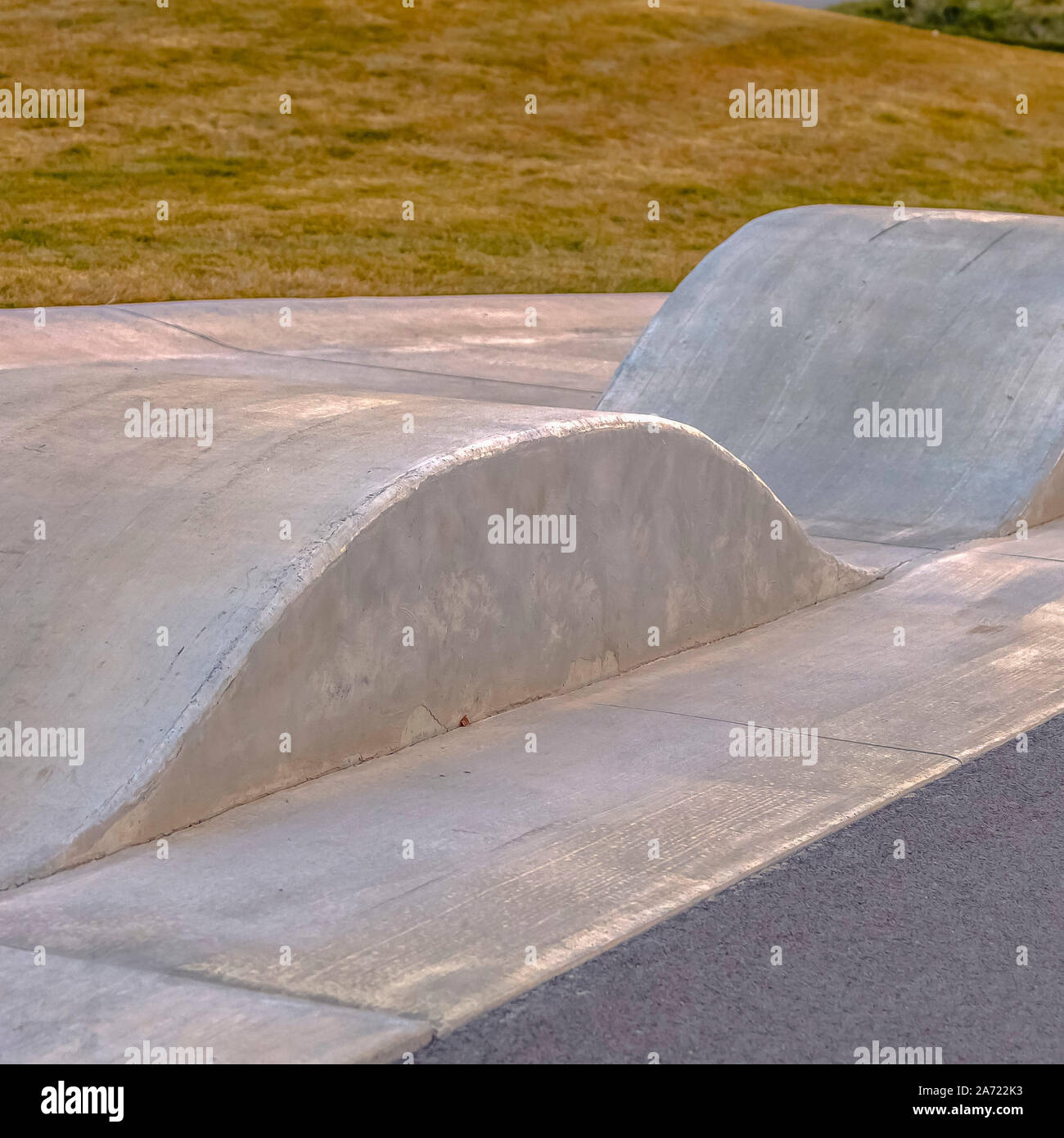 Square frame Concrete skateboard bike or scooter ramps in a ...