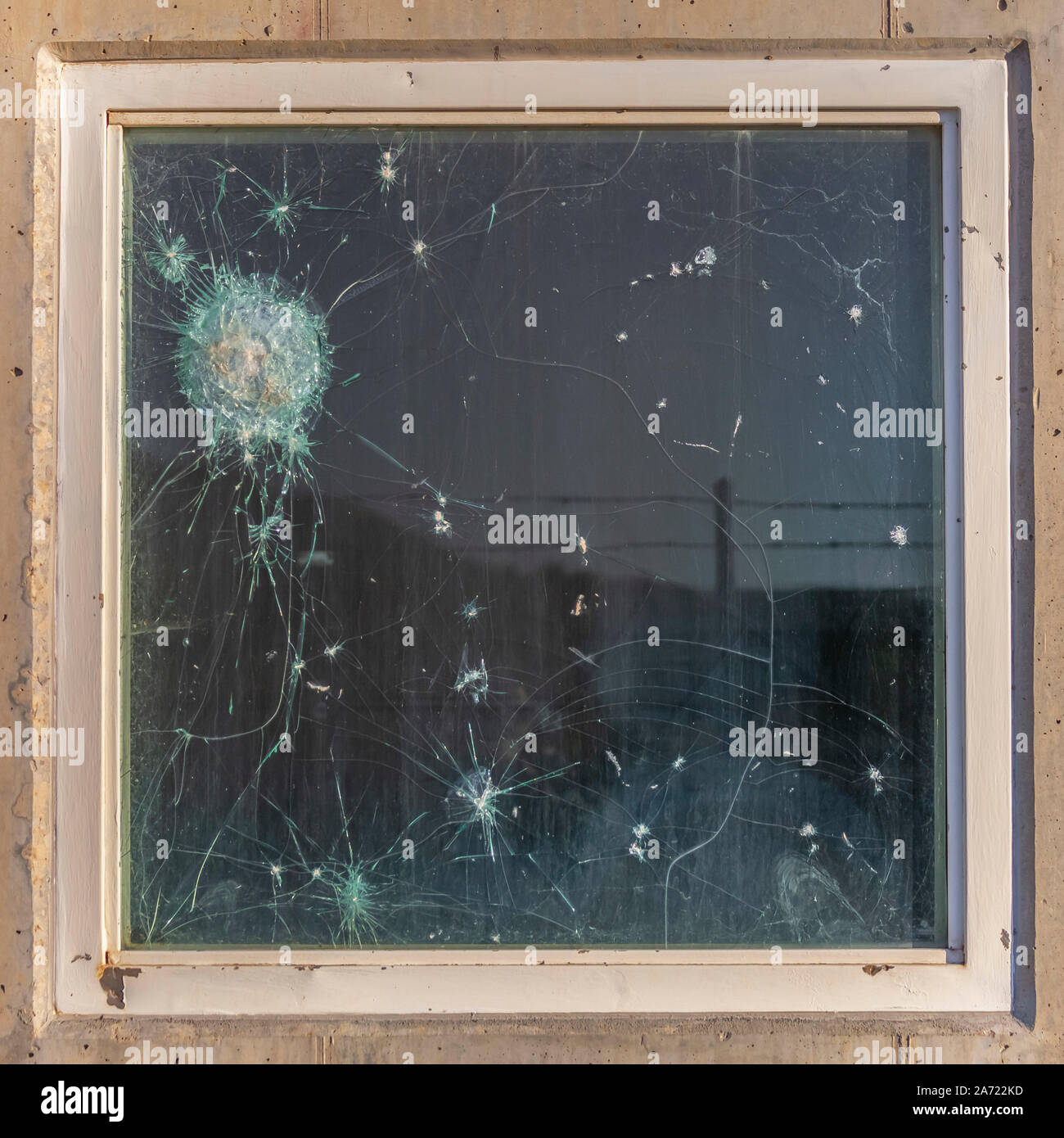 Square frame Bullet holes in the window glass of a bulletproof bunker ...