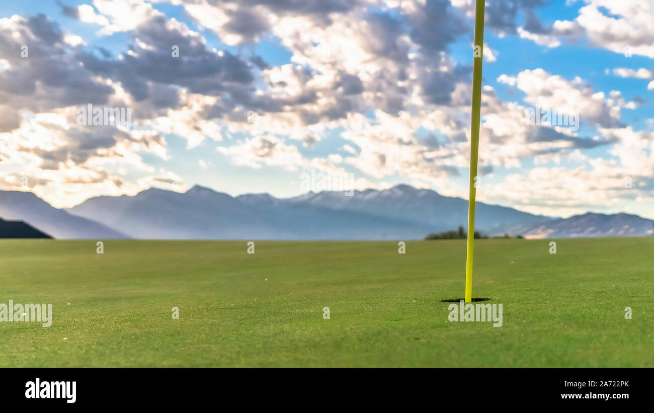 Panorama Flagstick or pin and hole or cup in the middle of putting ...