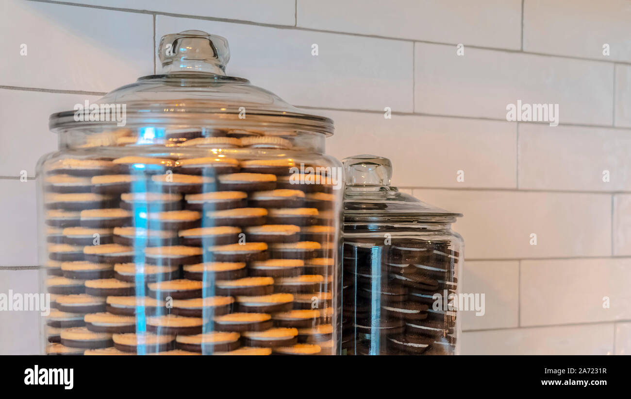 Panorama frame Large glass jars filled with cookies in kitchen Stock ...