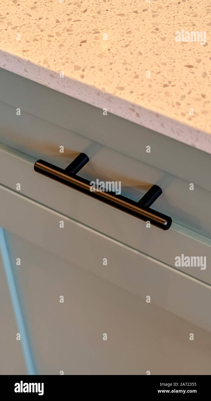 Vertical Close up of kitchen utensil draw under bench Stock Photo - Alamy